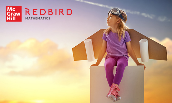 Young girl sitting on a box wearing cardboard wings